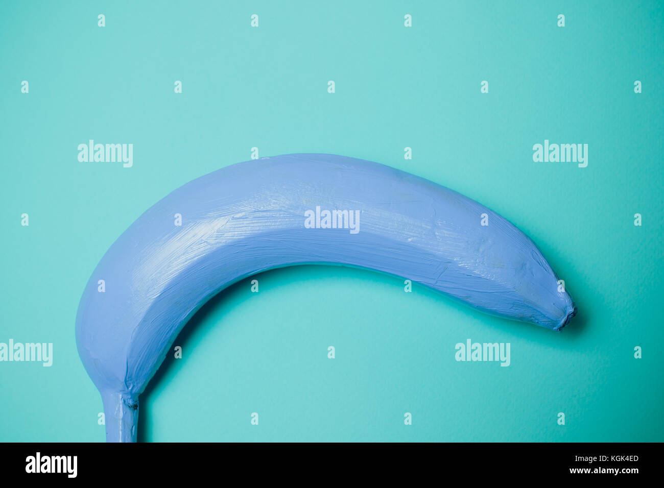 Blue banana on background Stock Photo - Alamy