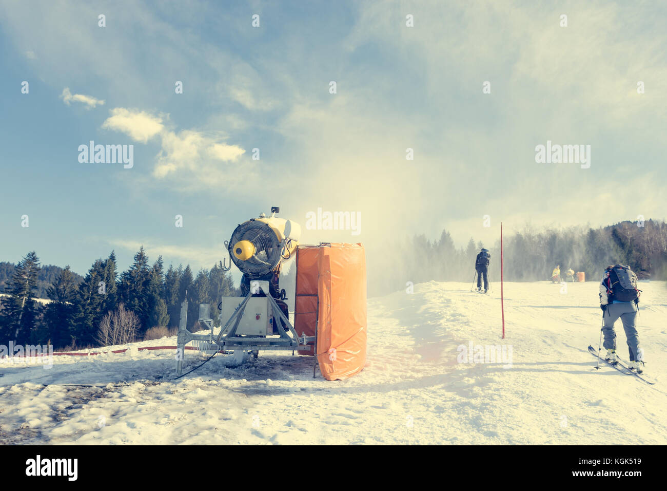 Ski resort with snow gun making new surface Stock Photo - Alamy