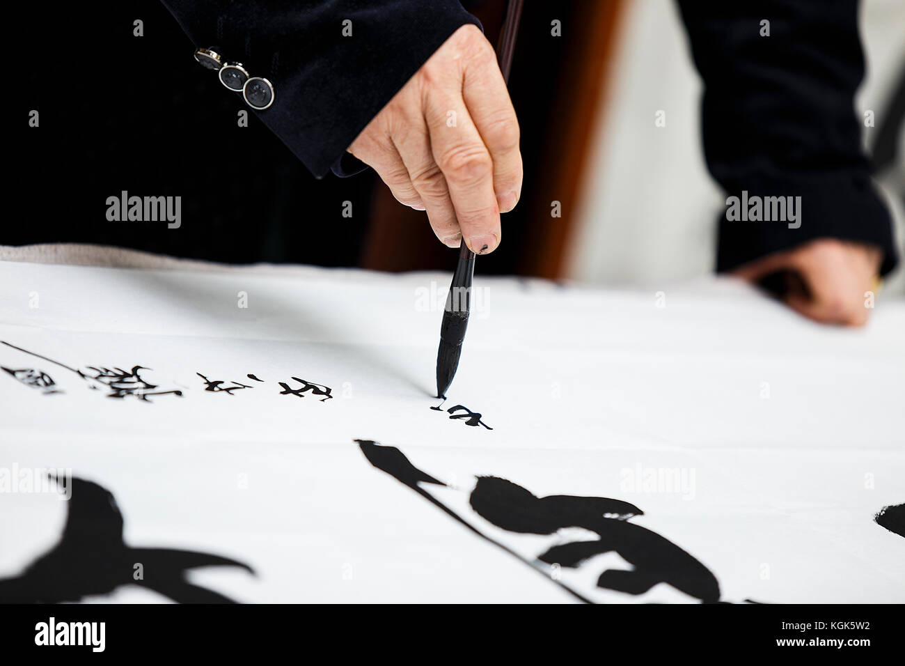 Calligrapher calligraphy man writing hi-res stock photography and ...