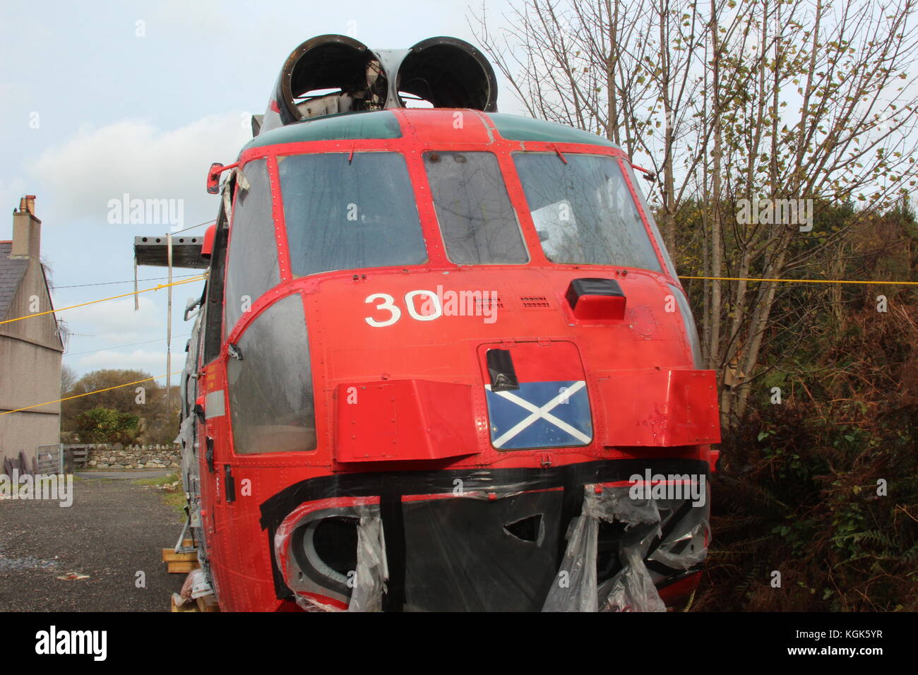 A old scrap Helicopter parked up in someone's backyard in Llanberis ...