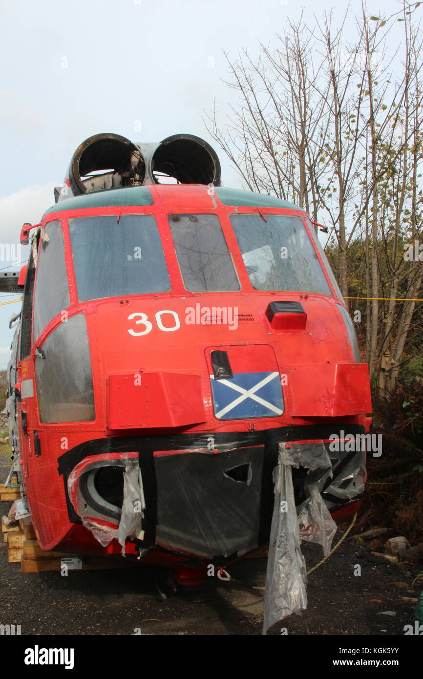 A old scrap Helicopter parked up in someone's backyard in Llanberis ...