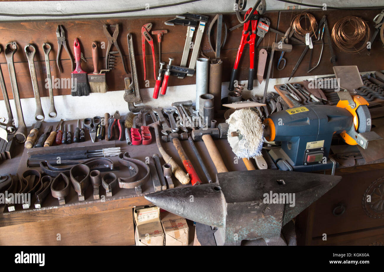 Tools and workbench in a traditional ironmongery workshop Stock Photo ...