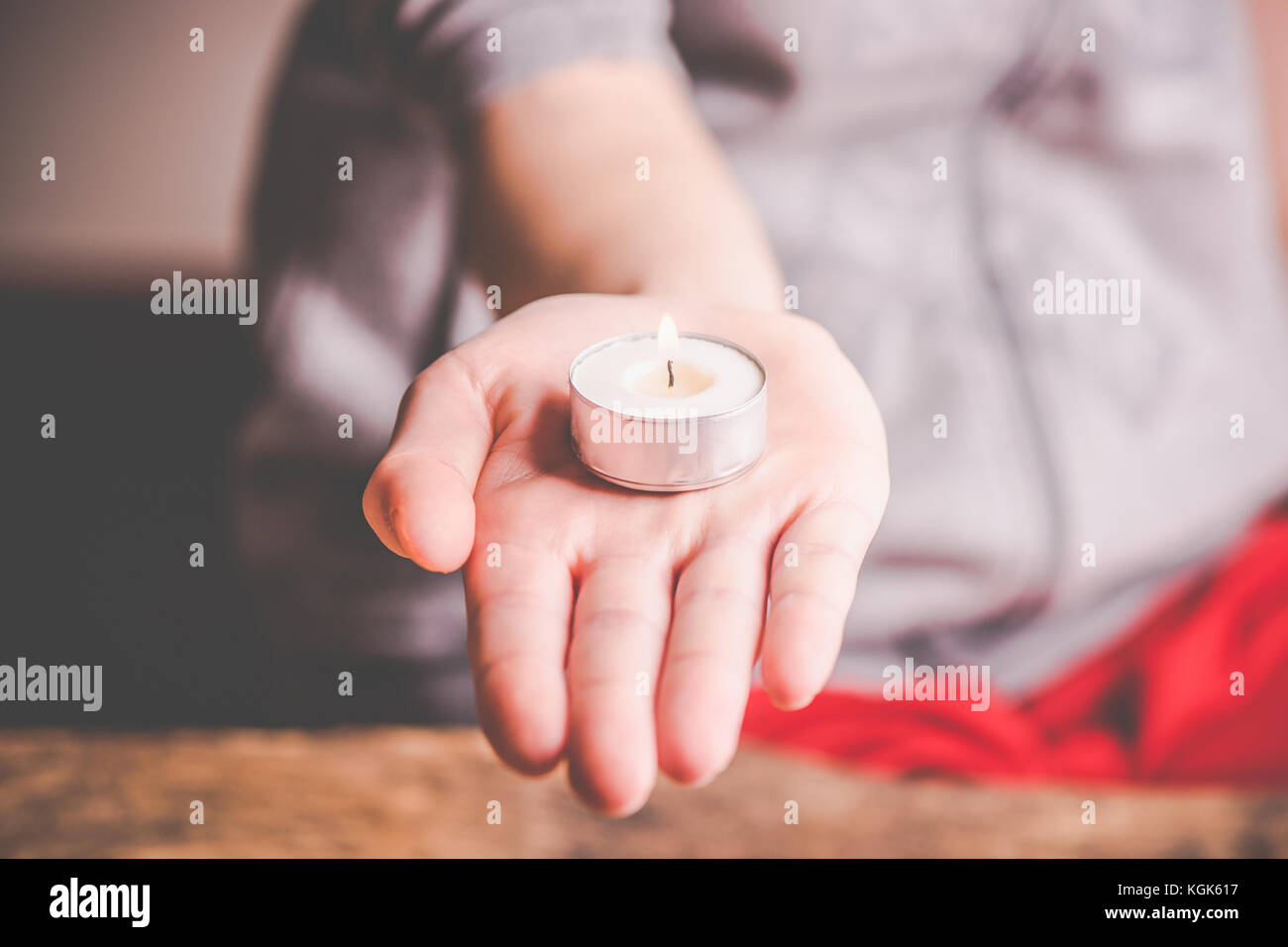 hands that offer the flame of a candle - sharing concept Stock Photo ...