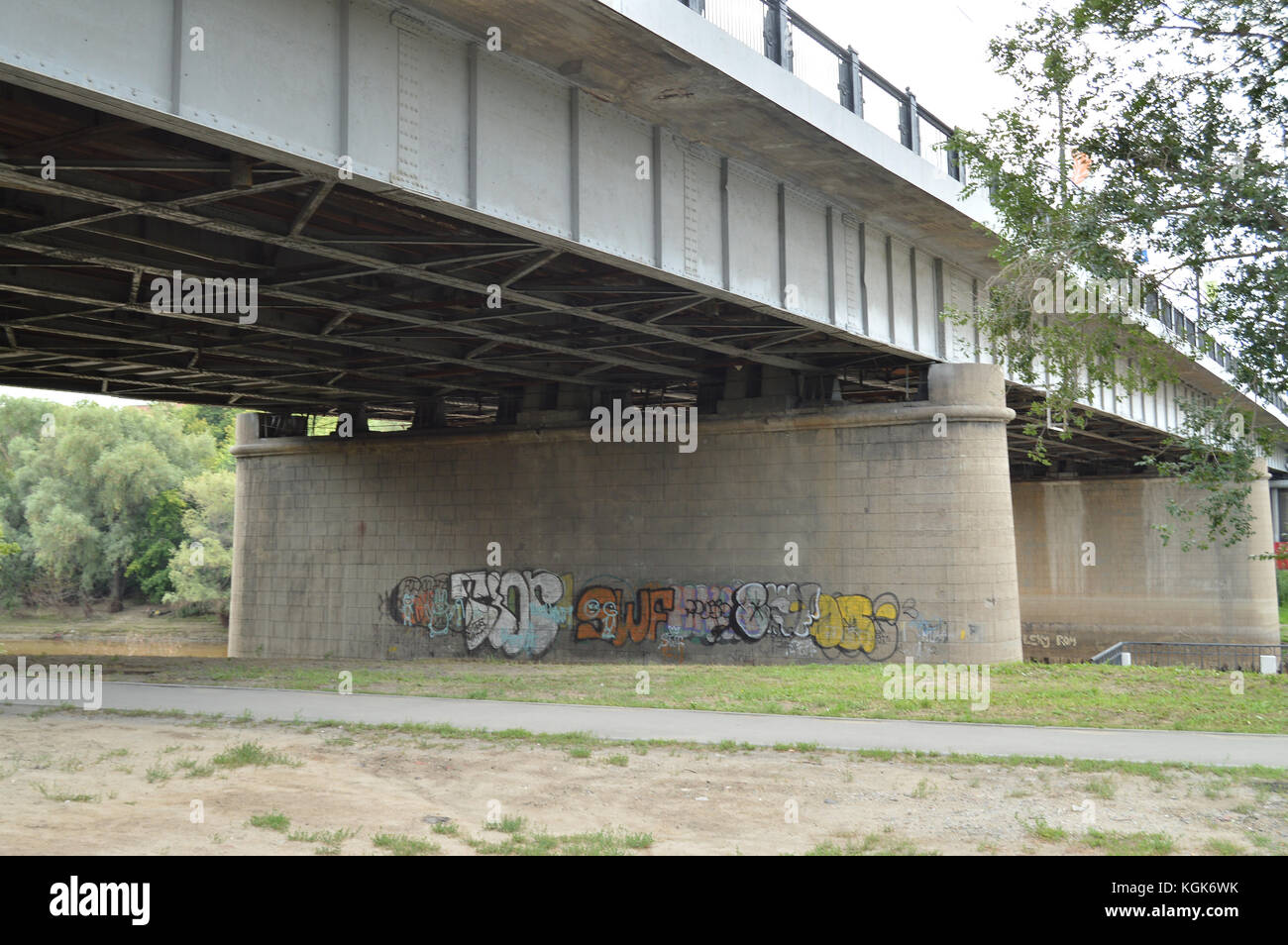 image of graffiti on the piers of the bridge across the river Stock ...