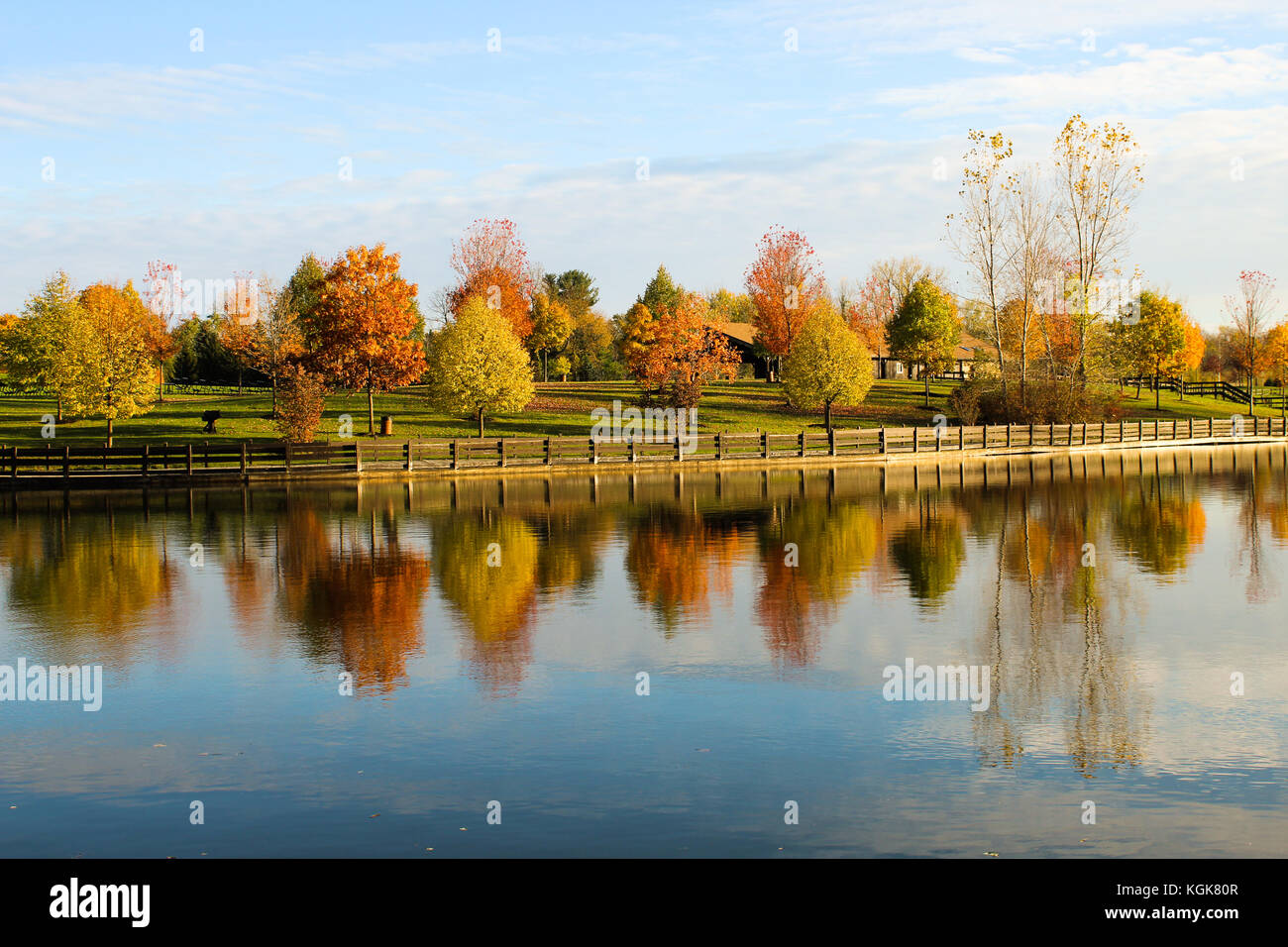 Autumn leaves in Michigan reflecting off of an inland lake in November ...