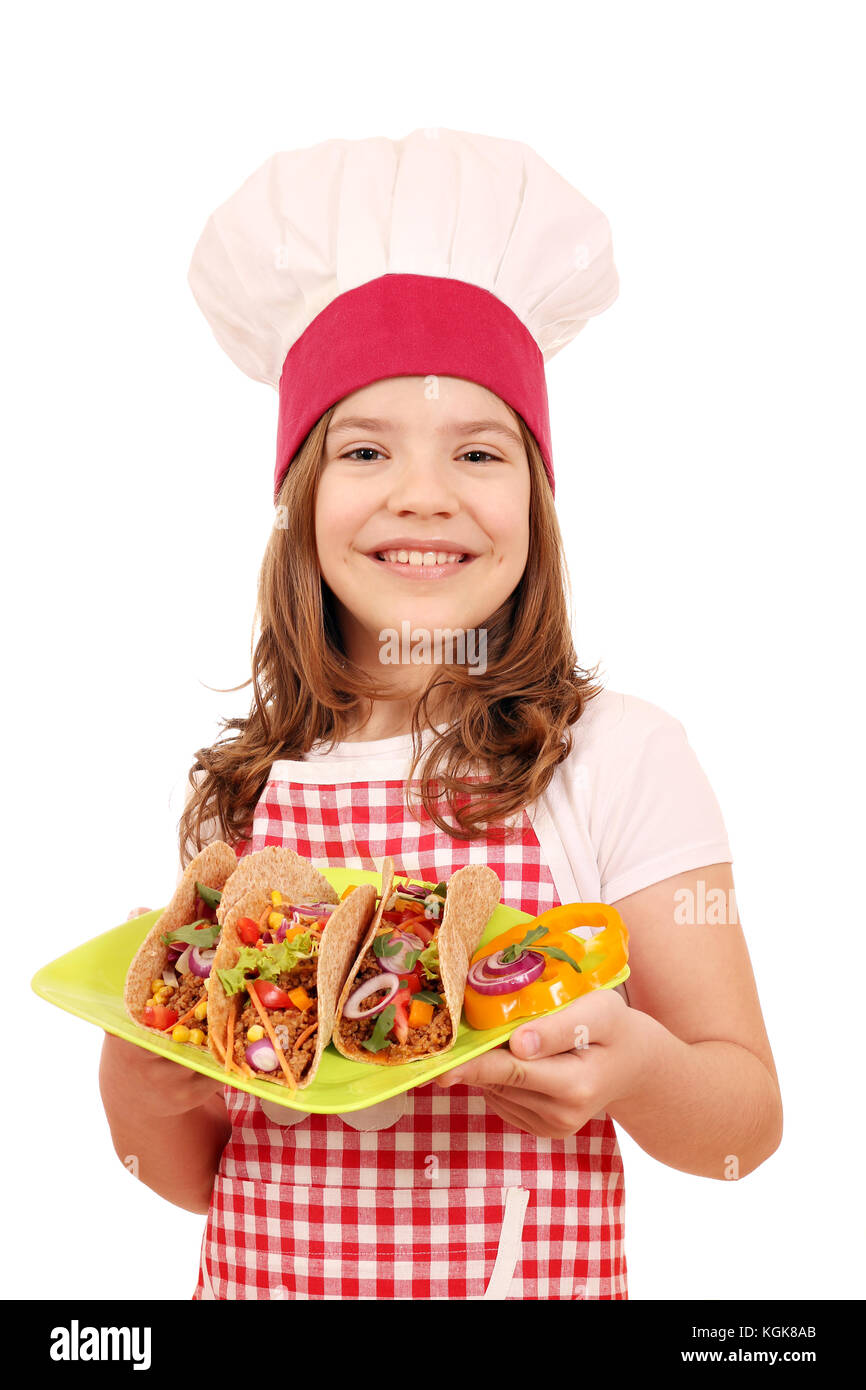 happy little girl cook with tacos on plate Stock Photo - Alamy