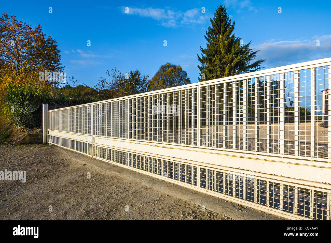 Long, sliding metal farm gate - France Stock Photo - Alamy