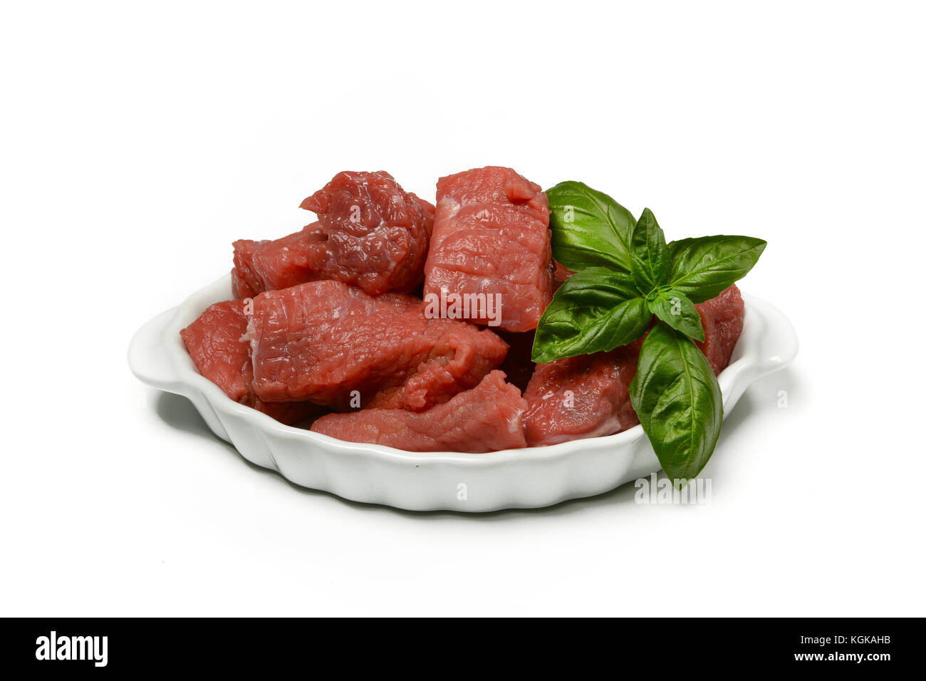 beef pieces on the white background - closeup Stock Photo - Alamy