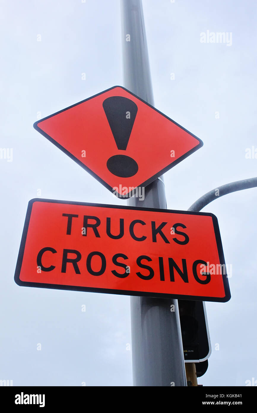 Street traffic warning sign trucks crossing Stock Photo - Alamy