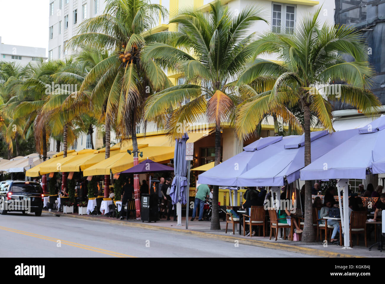 Colorful canopied storefronts, cafes, and restaurants on Ocean Drive in ...