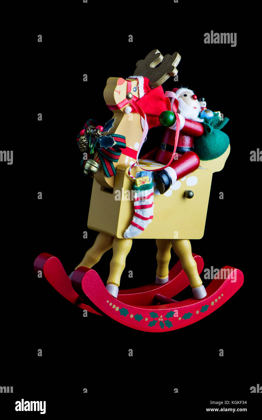 Christmas decorations depicting Santa Claus riding his rocking reindeer ...