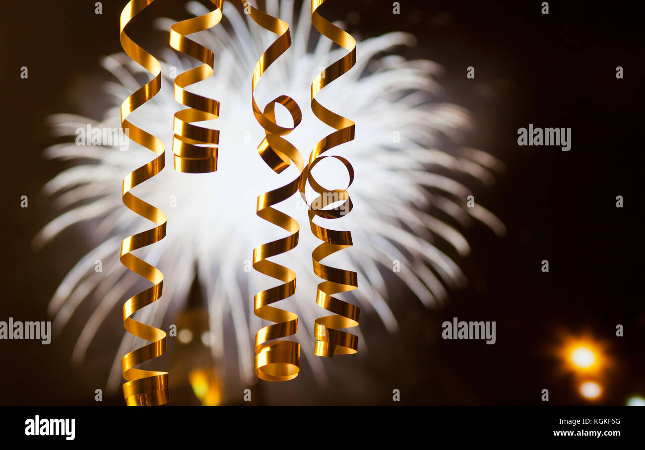 ribbons against fireworks - new year celebrations Stock Photo - Alamy