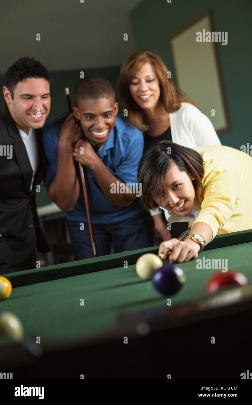 Diverse group of people playing pool Stock Photo - Alamy