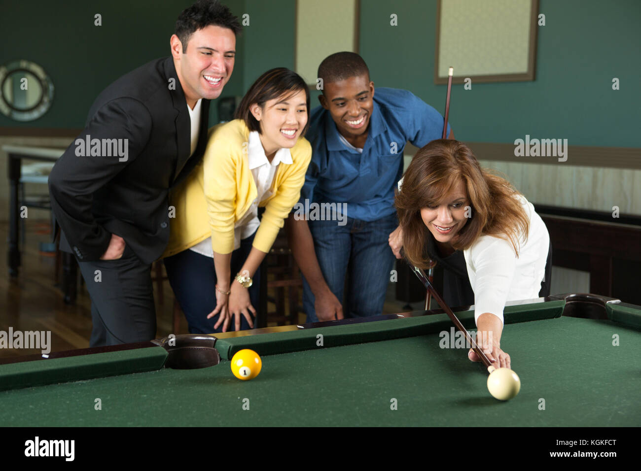Diverse group of people playing pool Stock Photo - Alamy
