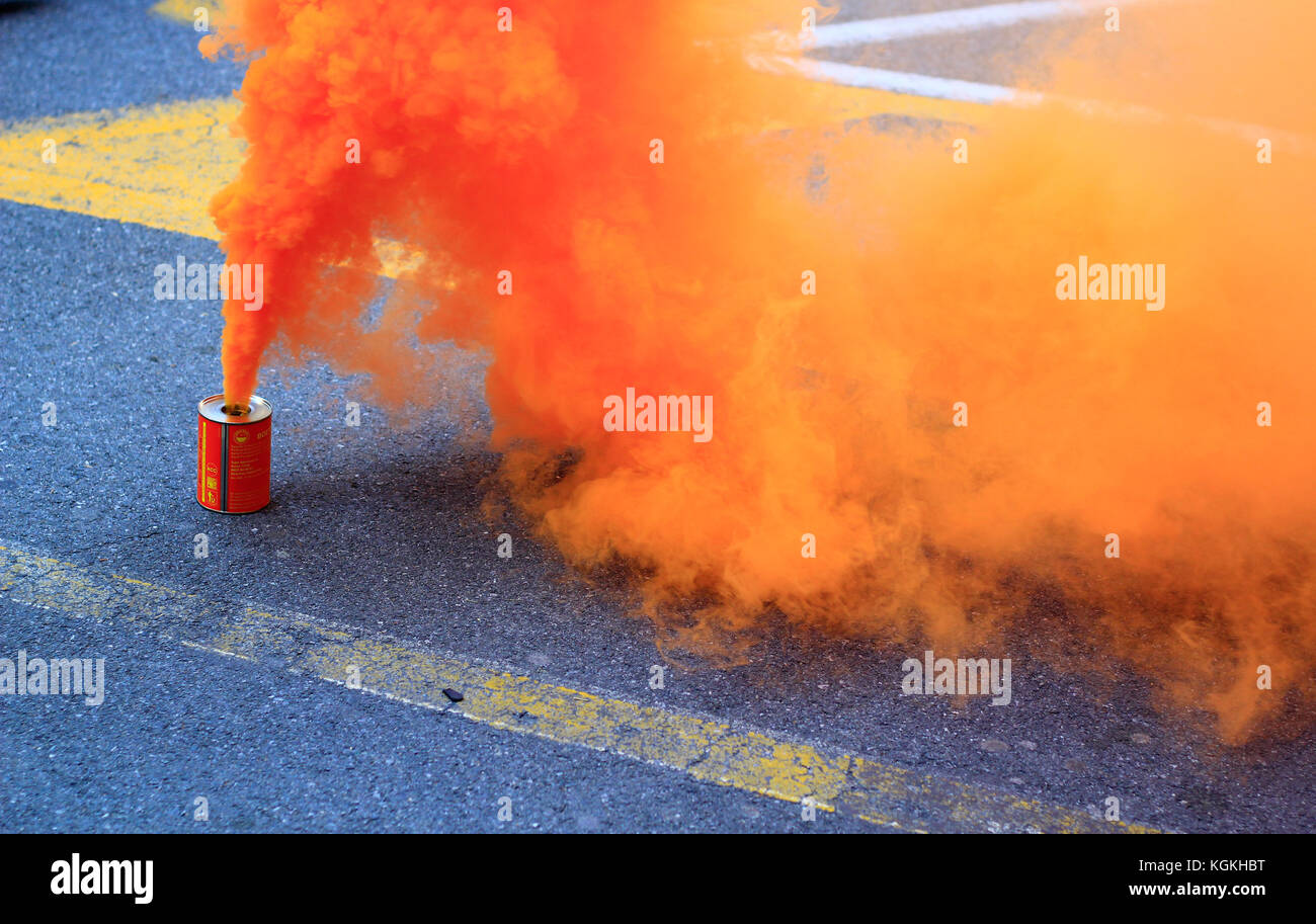 Orange smoke that exits from a cans Stock Photo - Alamy