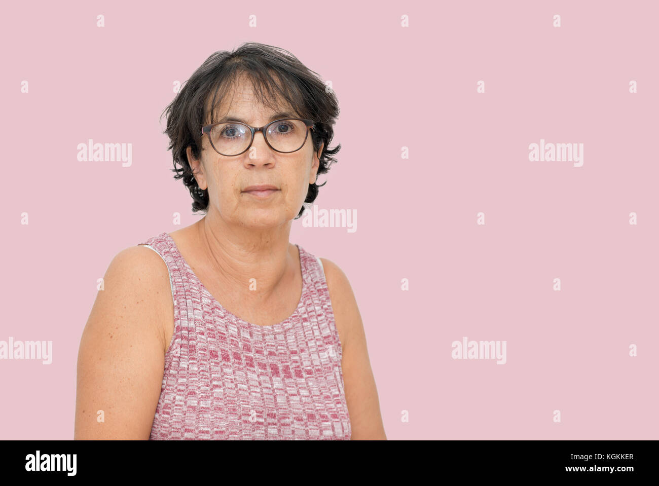 a portrait of mature brunette woman with glasses Stock Photo - Alamy