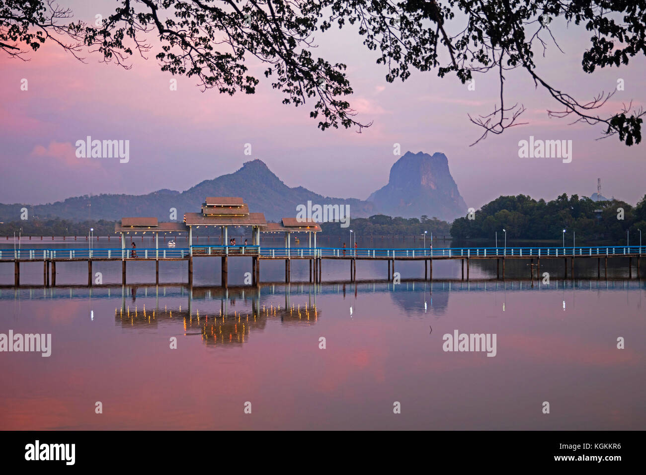 Wooden bridge over Kan Thar Yar Lake at sunset, Hpa-an, Kayin State ...