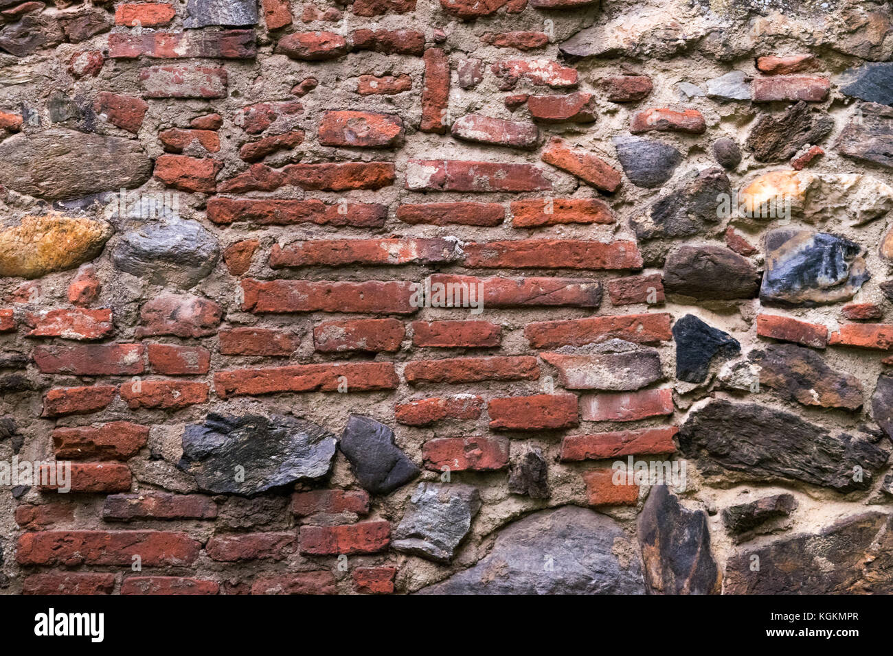 Medieval wall built of stone and bricks, background texture Stock Photo ...