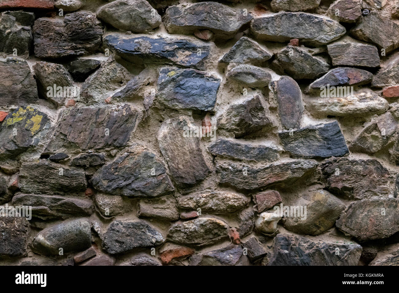 Medieval wall built of stone and bricks, background texture Stock Photo ...