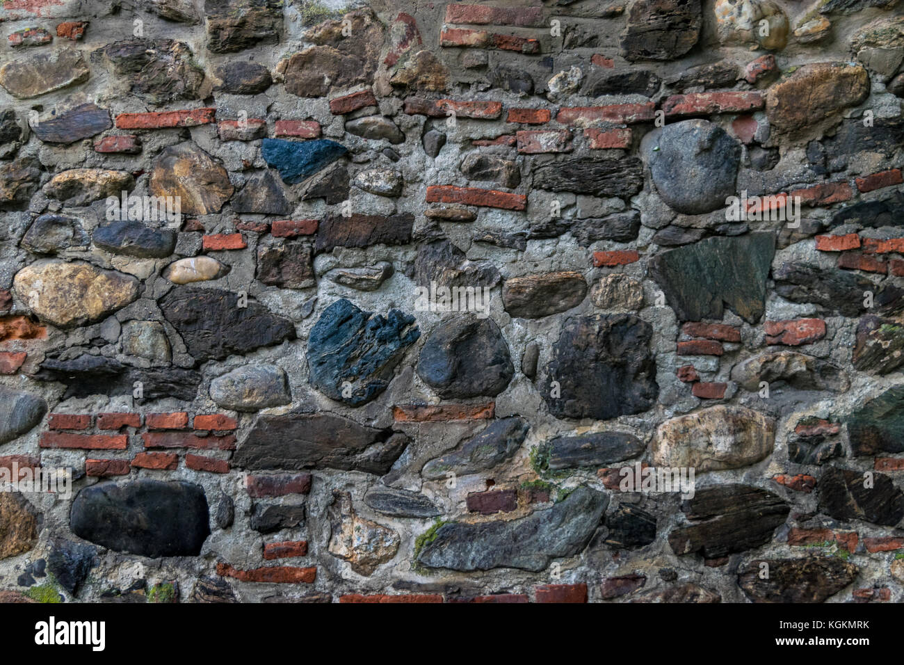 Medieval wall built of stone and bricks, background texture Stock Photo ...