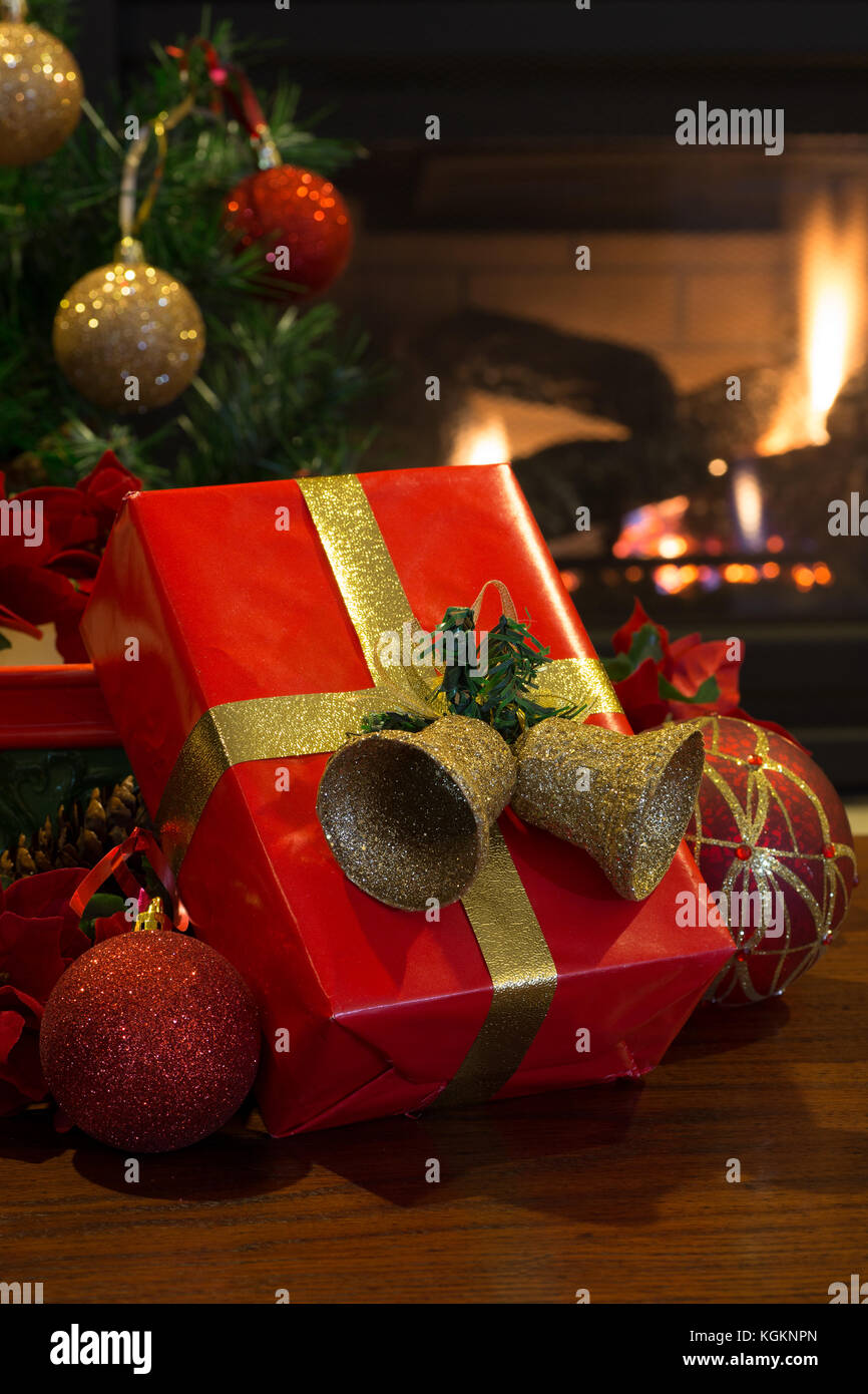 Red Christmas presents with tree and fireplace in background Stock ...