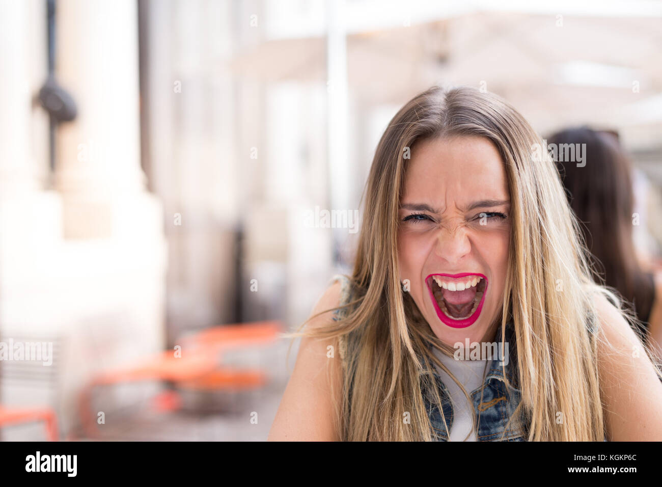 Angry young girl, portrait photo with copy space Stock Photo - Alamy
