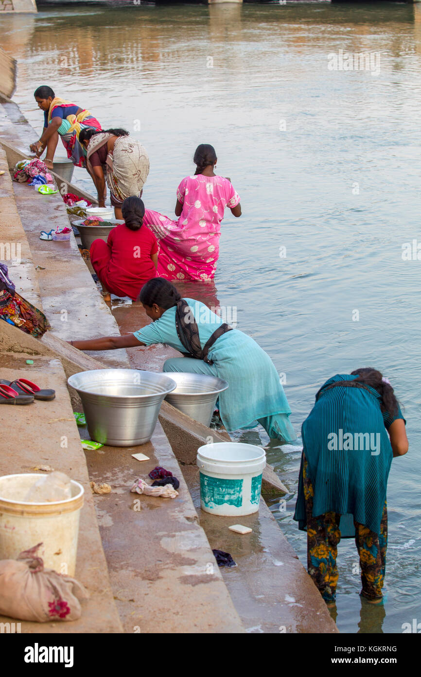 Womans washing clothes at Tungabhadra Canal, Hospet, Karnataka, India ...