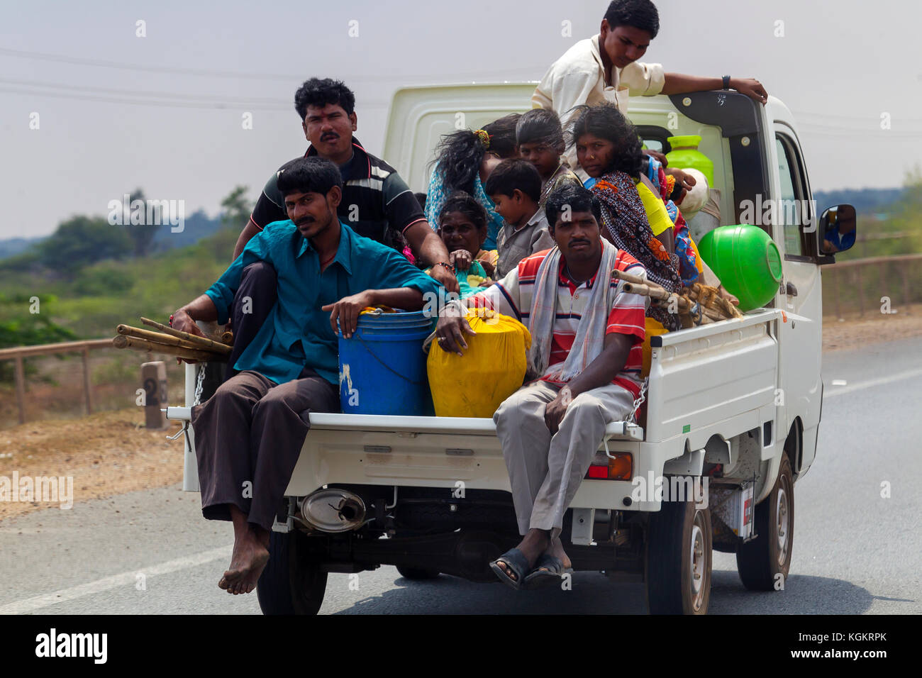 Indian people being transported in the back of comercial vehicles ...