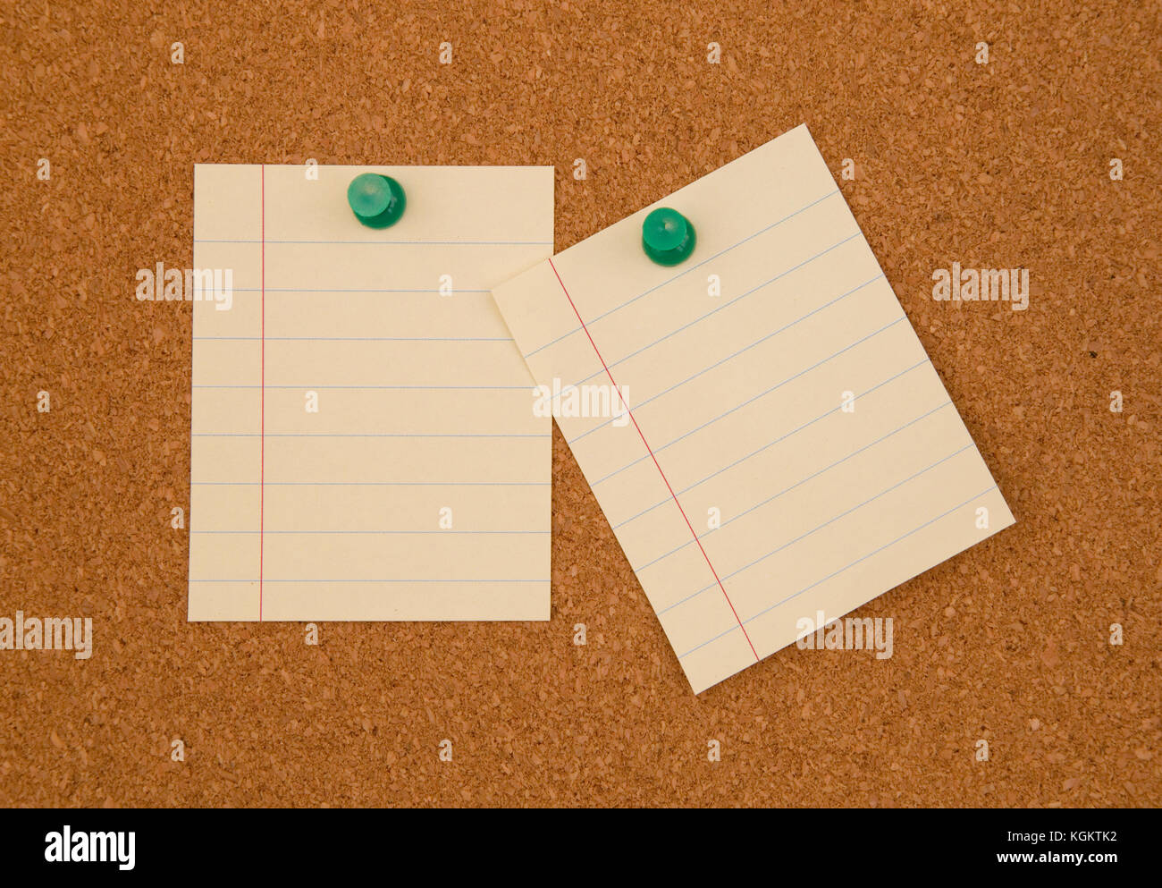 Two Pieces of Notebook Paper Pinned to a Cork Board Stock Photo - Alamy
