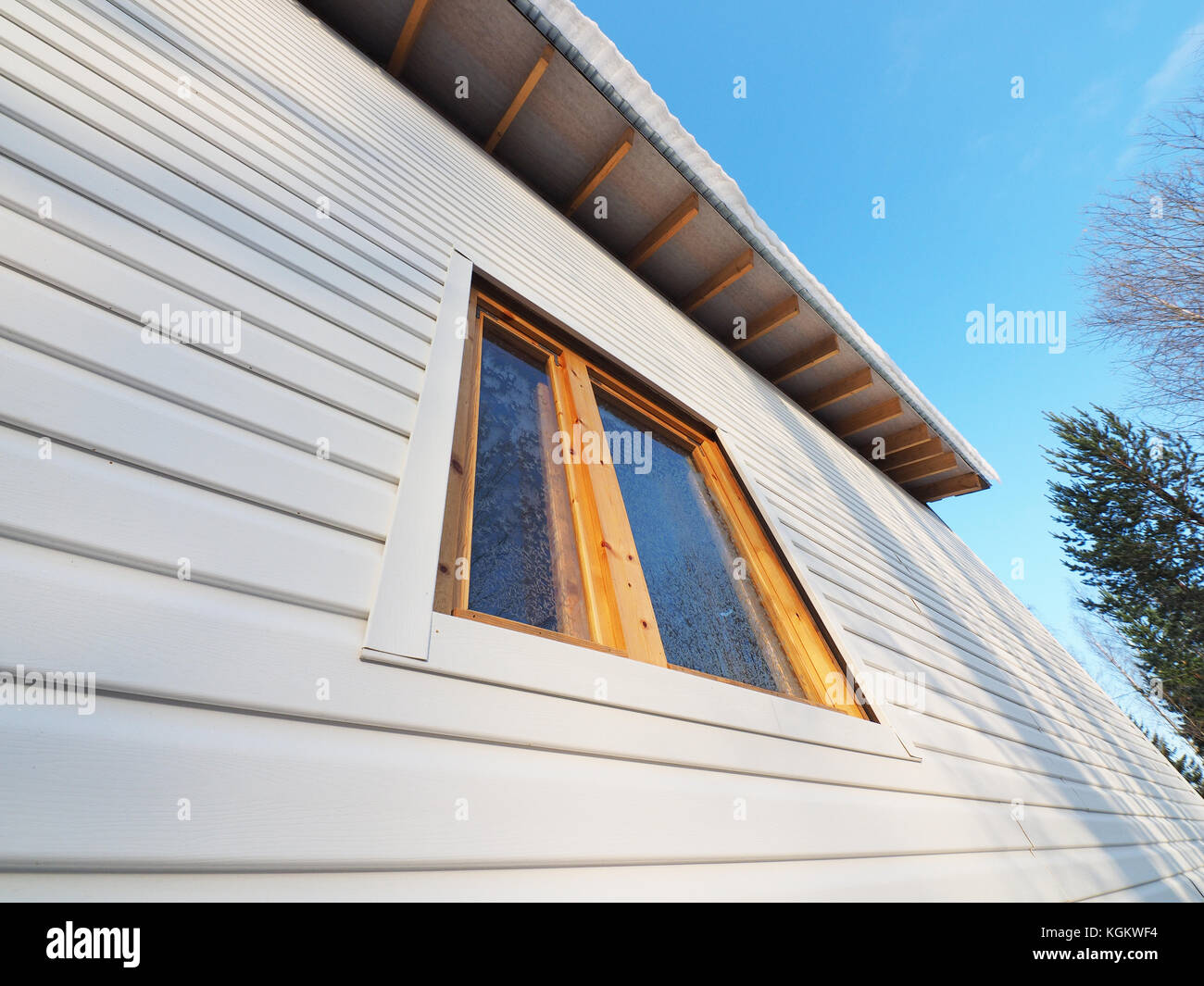 wooden window on white siding background Stock Photo - Alamy