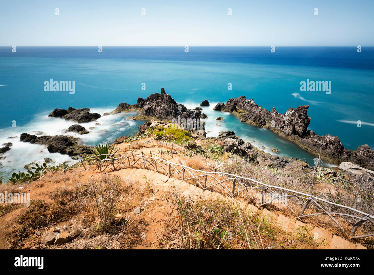 Long exposure of a path leading down to rocky a tide pool area near ...
