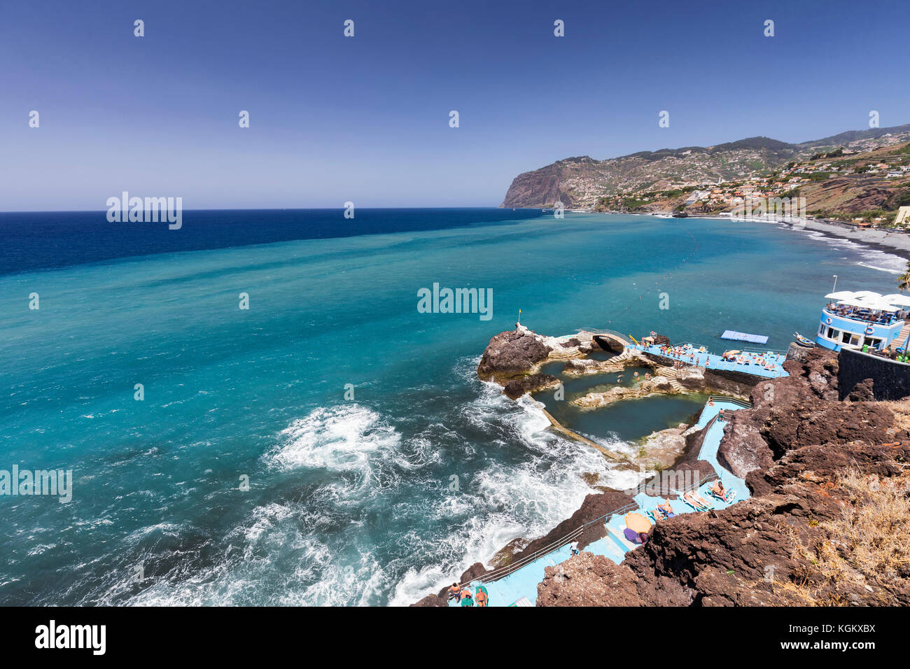 Different colored waters behind ocean water pools in Sao Martinho on ...
