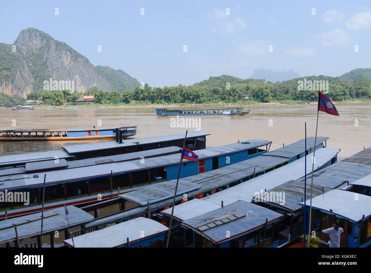 Boats parking on the Mekong Rover in front of Pak Ou Caves, Luang ...