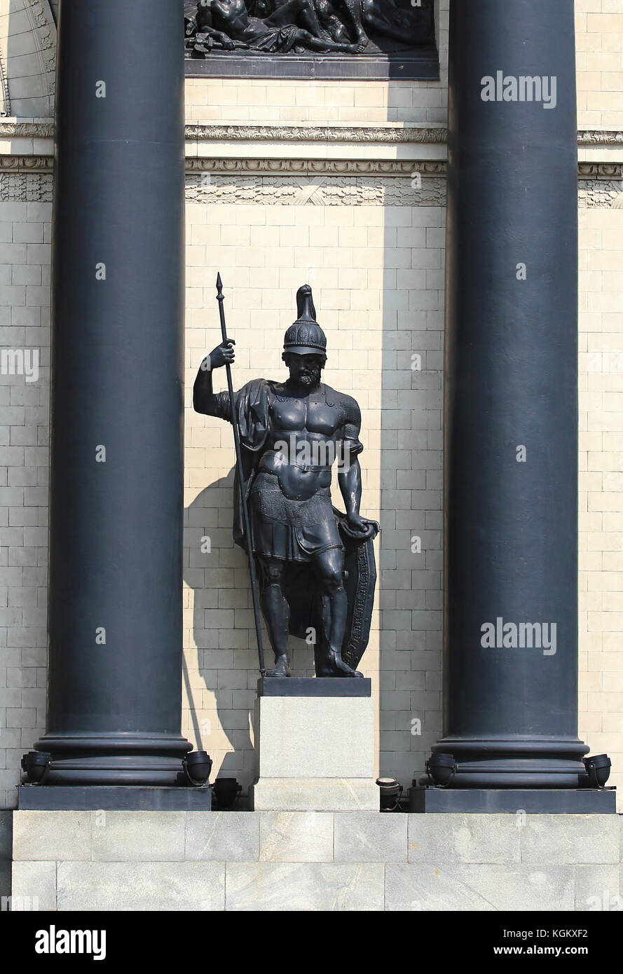 Cast-iron statue of a medieval warrior in armor located between columns ...