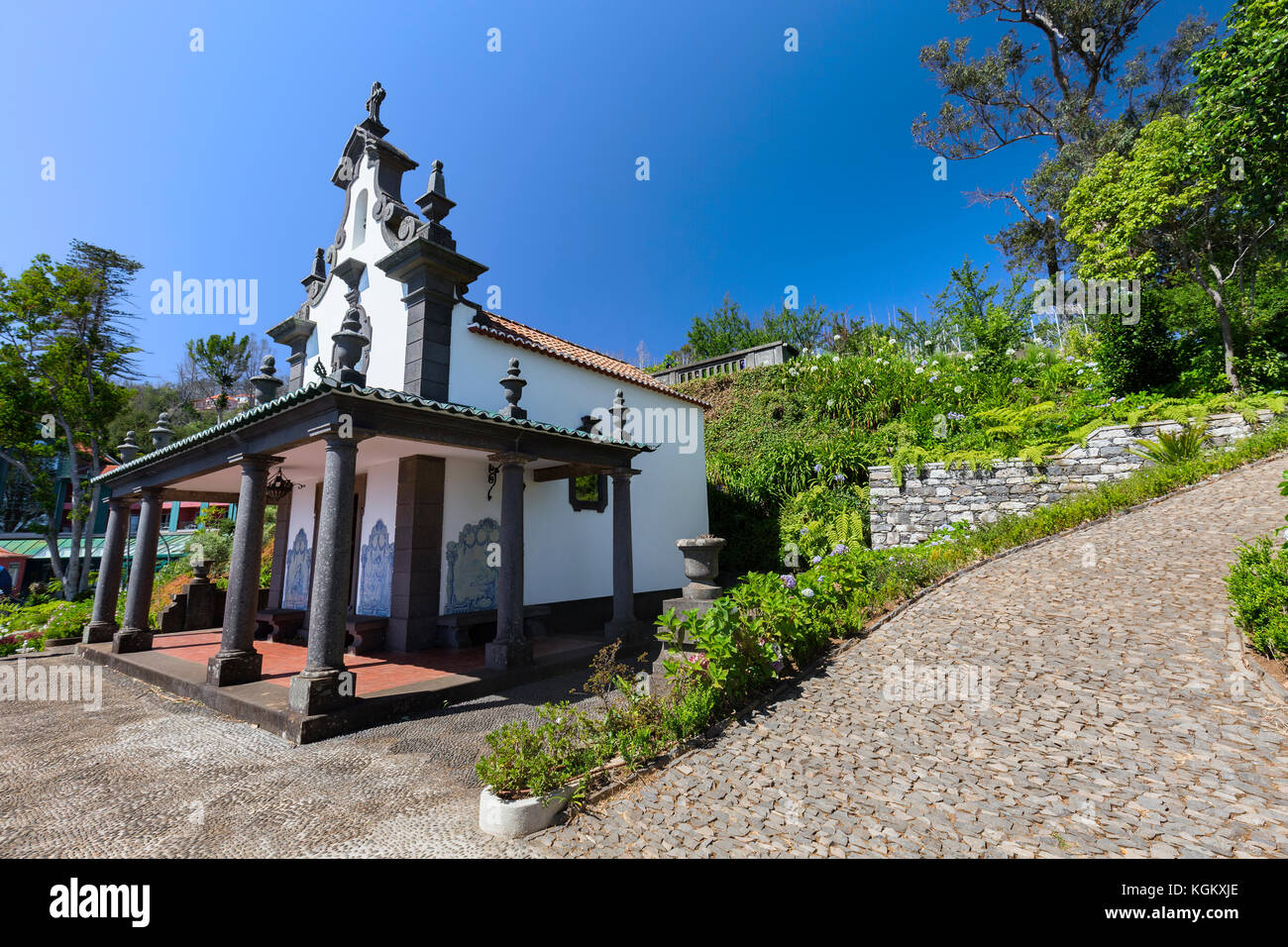 The Sancta Maria Chapel surrounded by intricate cobblestone pathways ...