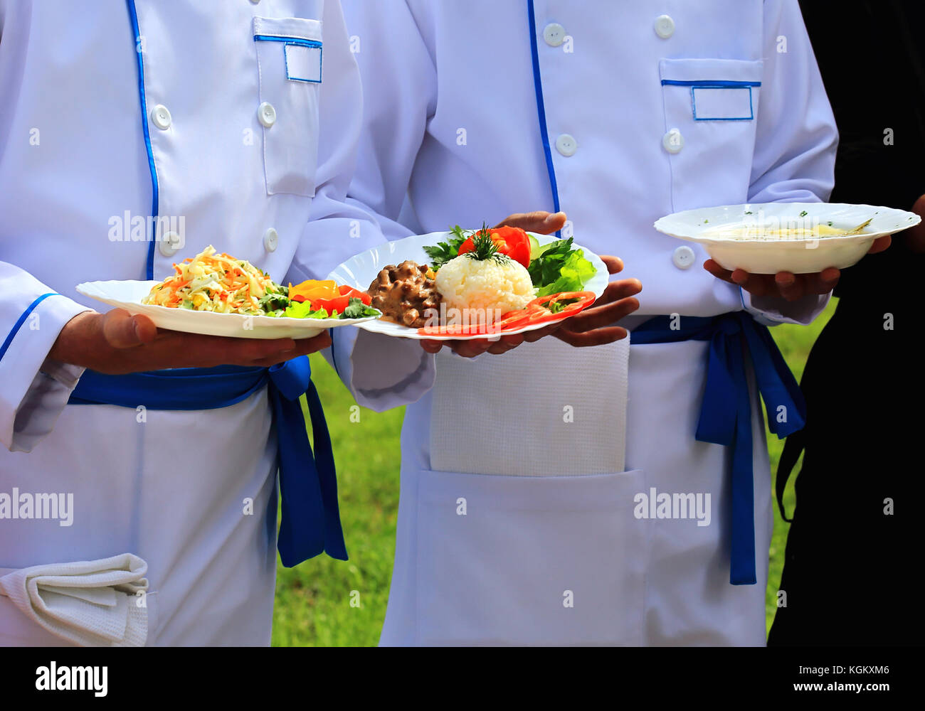 Chefs offer culinary specialties on plates for competition Stock Photo ...