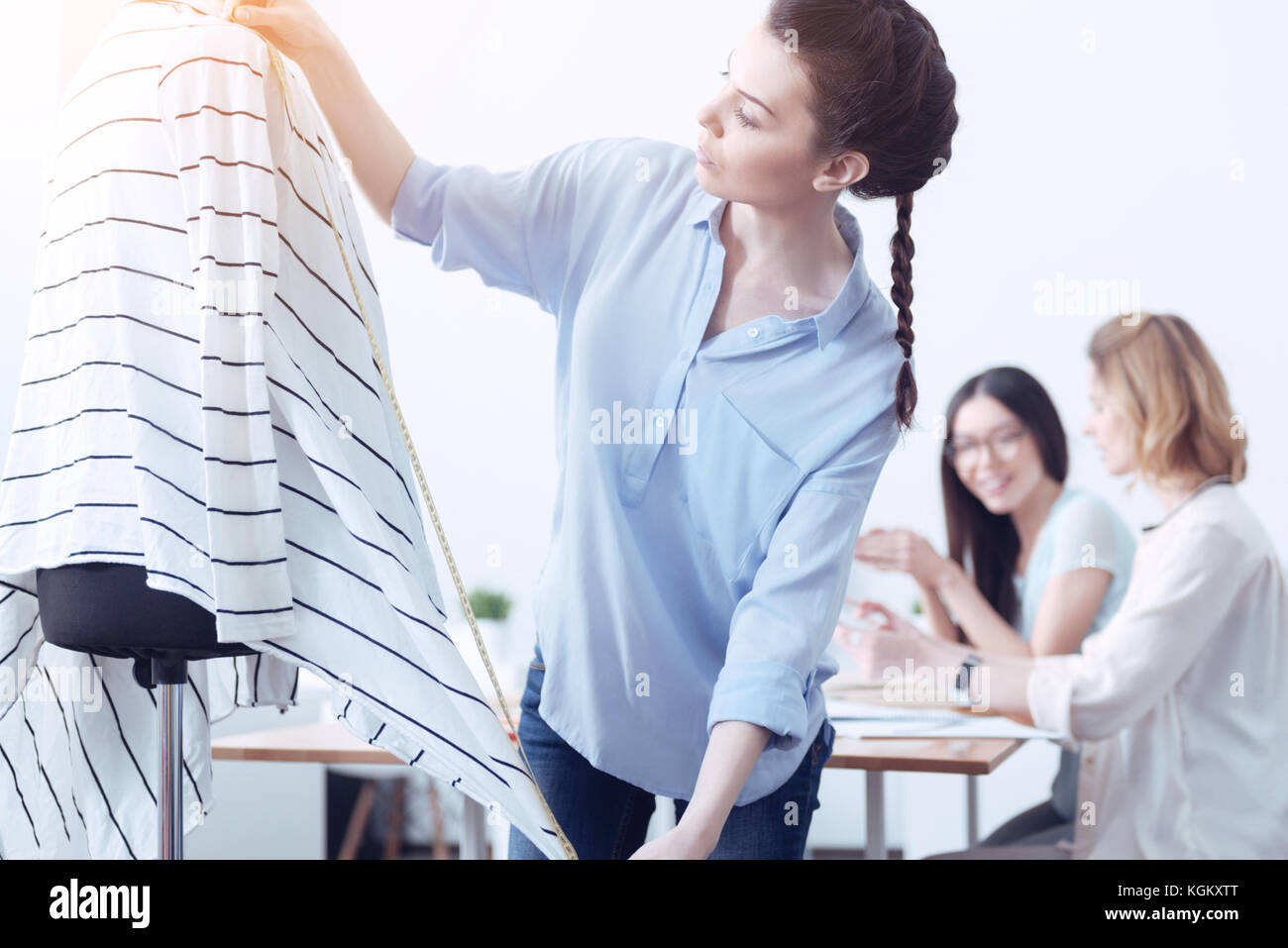 Concentrated professional tailor working at the new order Stock Photo ...