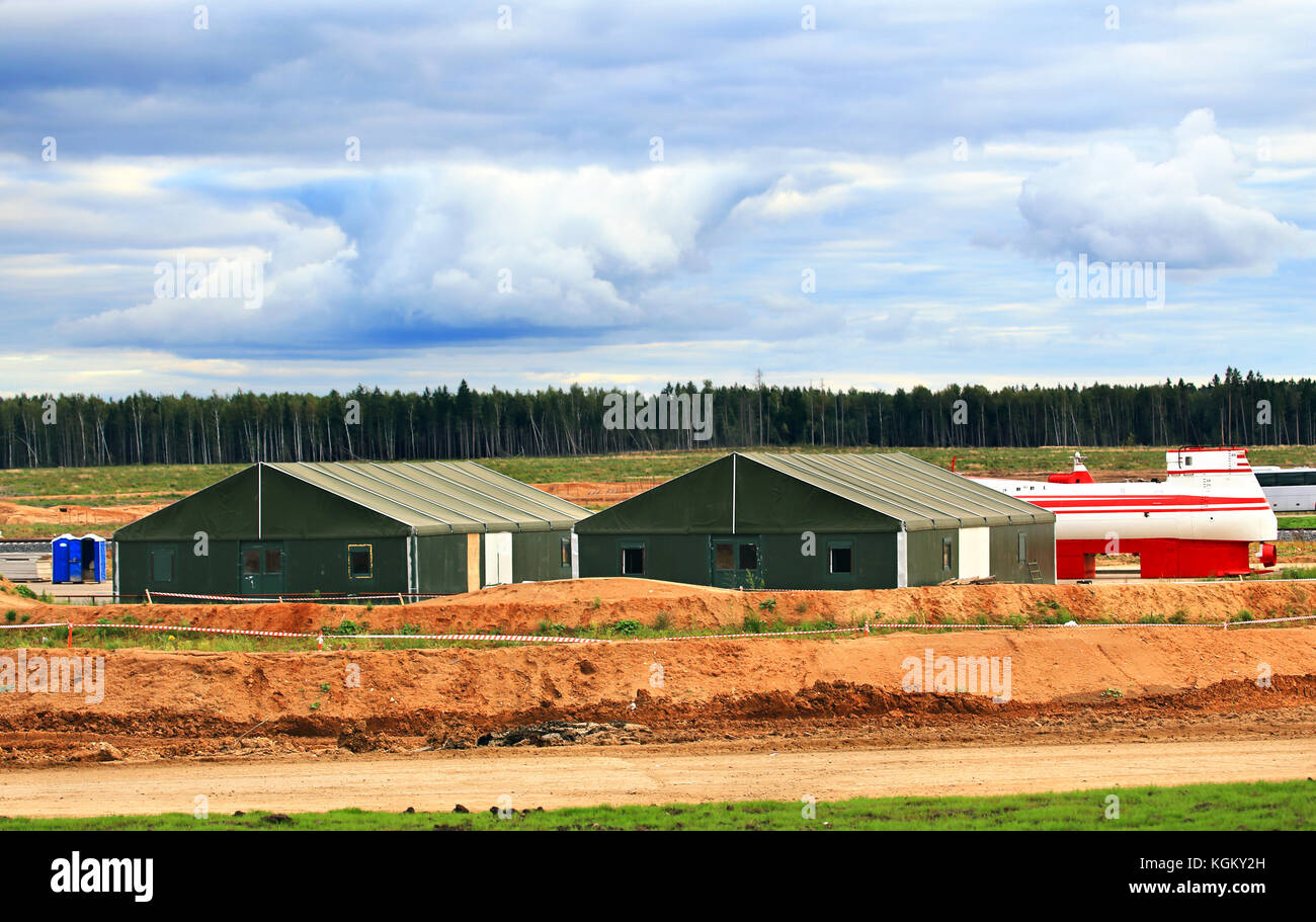 Two big tents on a large-scale construction site Stock Photo - Alamy