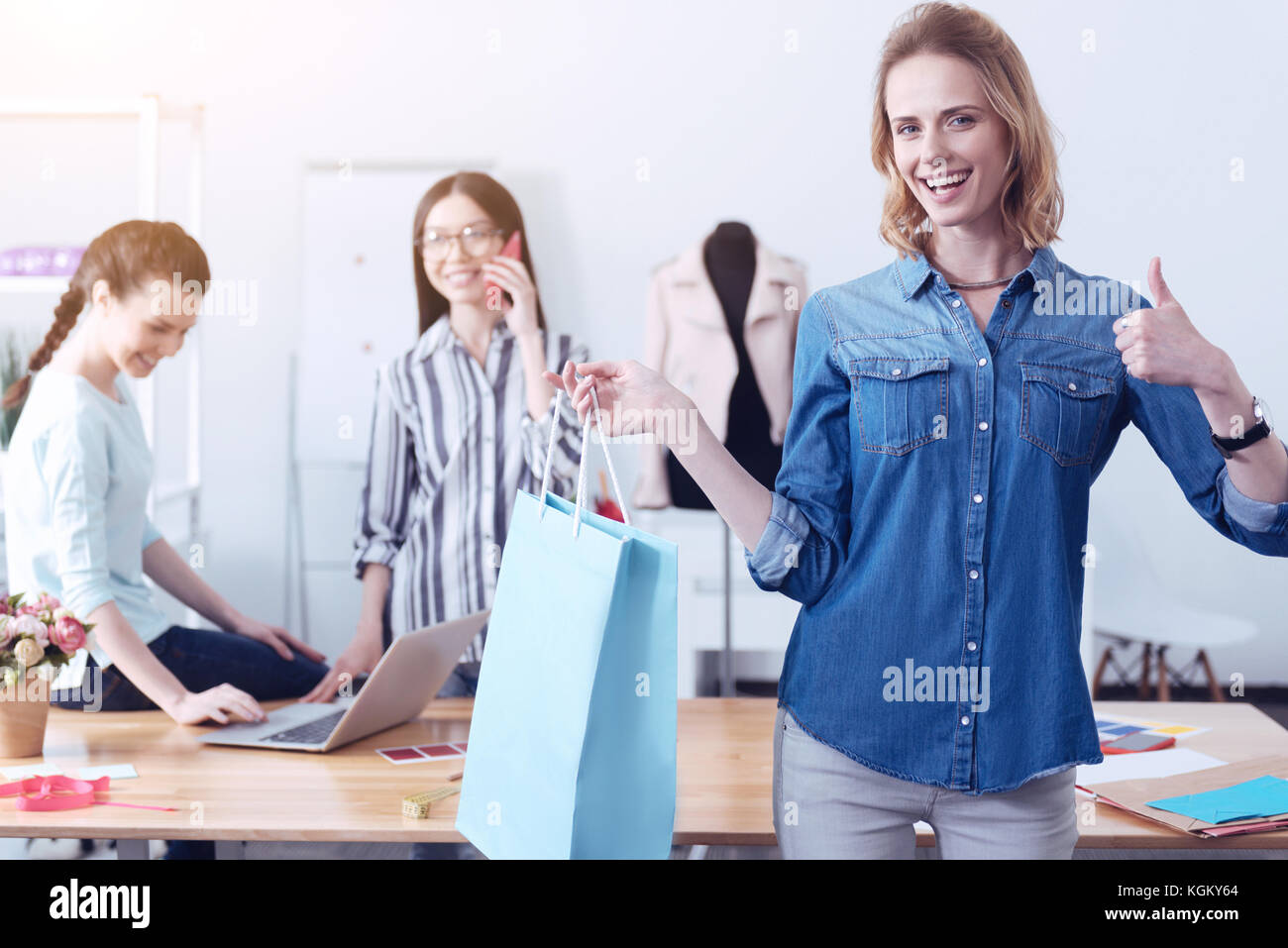 Young manager looking satisfied with the results of her coworkers Stock ...