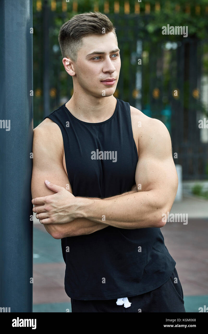 Male athlete standing arms hi-res stock photography and images - Alamy