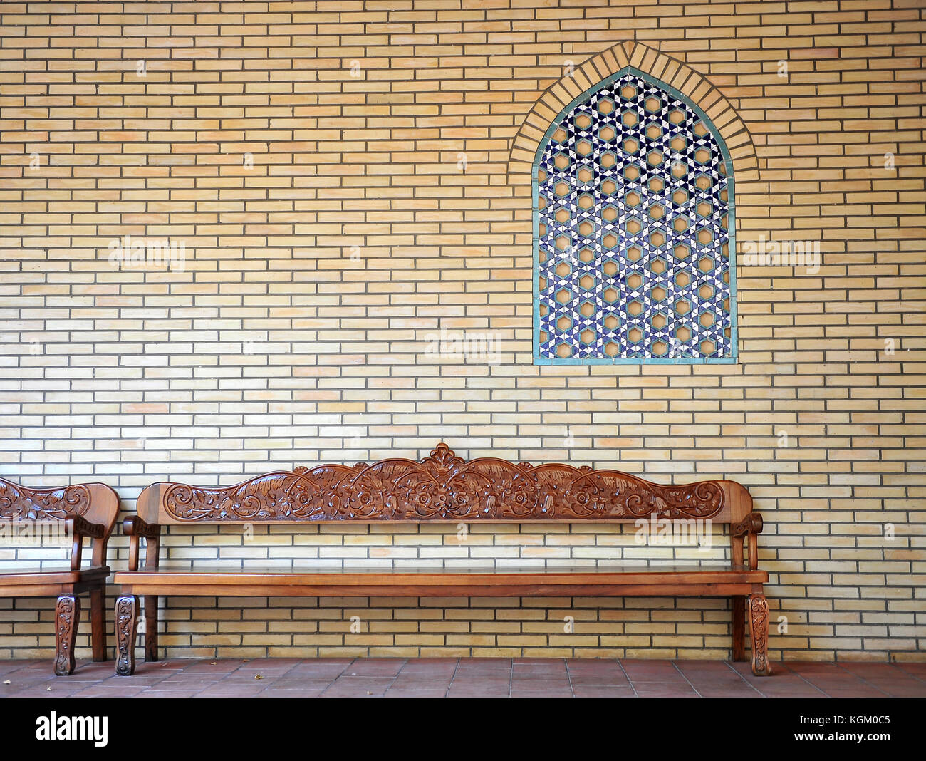 Bench at the wall with traditional arabic ornament Stock Photo - Alamy
