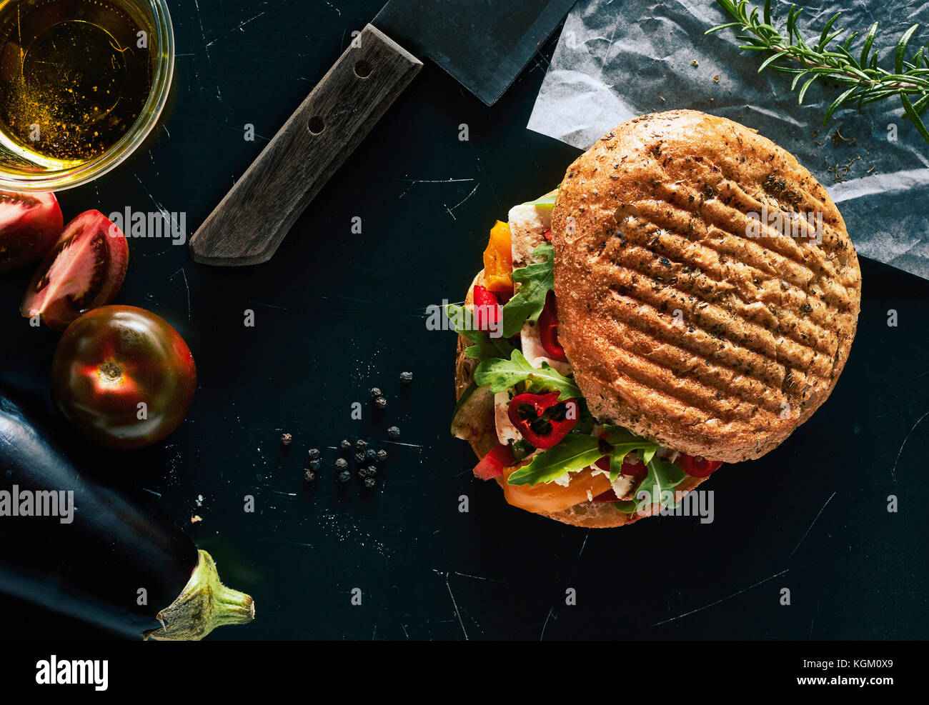 High angle view of burger with ingredients on granite Stock Photo - Alamy