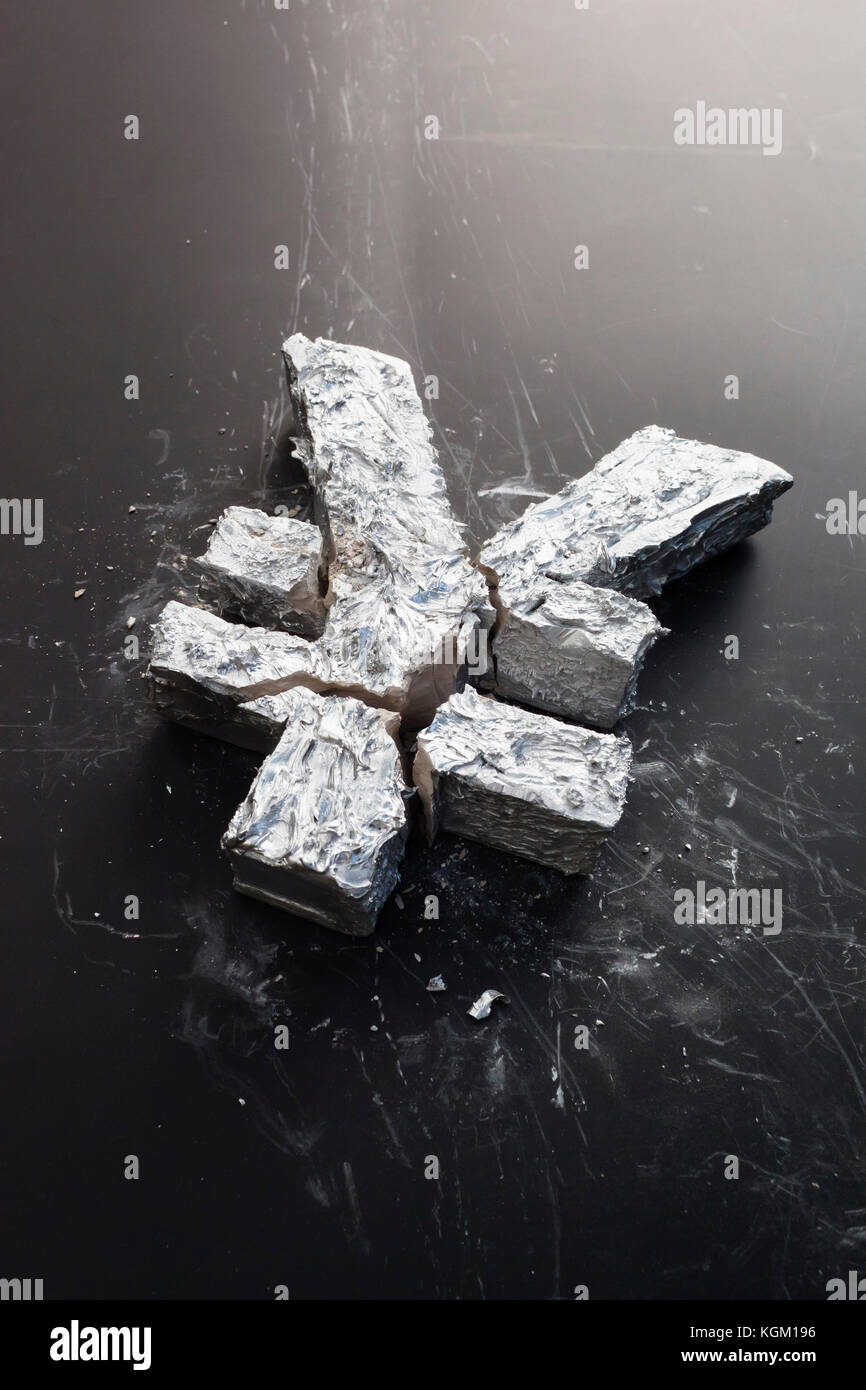 High angle view of broken Yuan sign on black table Stock Photo - Alamy
