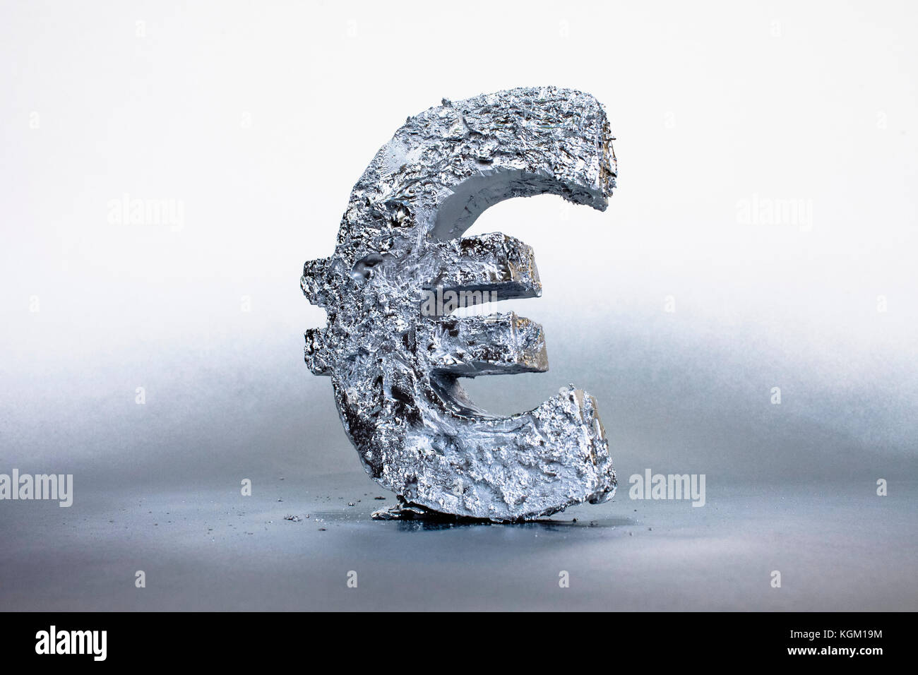 Close-up of silver Euro symbol against gray background Stock Photo - Alamy