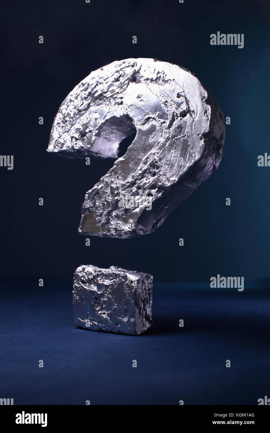 Close-up of silver question mark against black background Stock Photo ...