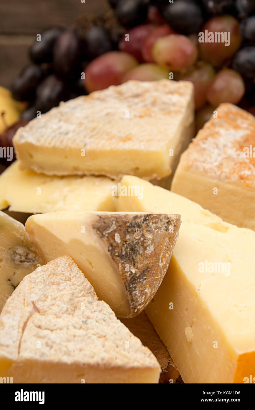 Moldy cheese blocks and grapes Stock Photo - Alamy
