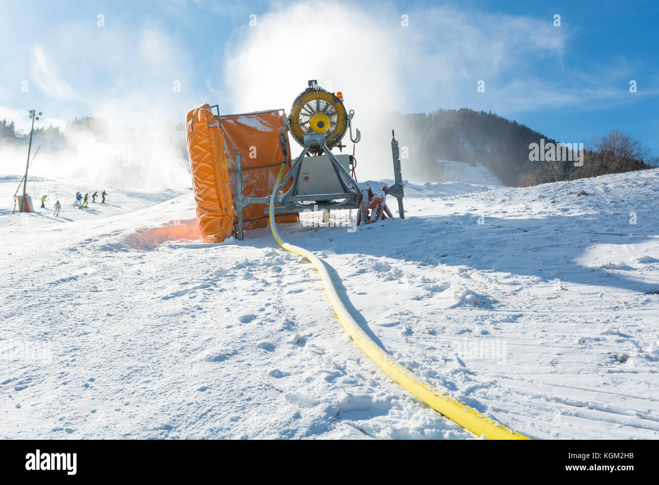 Ski resort with snow gun making new surface Stock Photo - Alamy