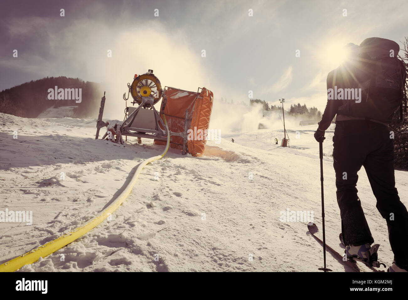 Ski resort with snow gun making new surface Stock Photo - Alamy