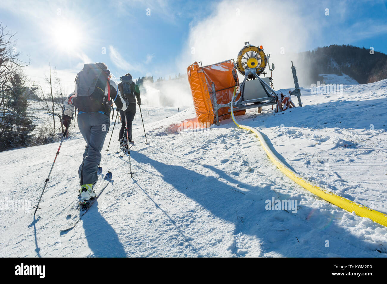 Ski resort with snow gun making new surface Stock Photo - Alamy
