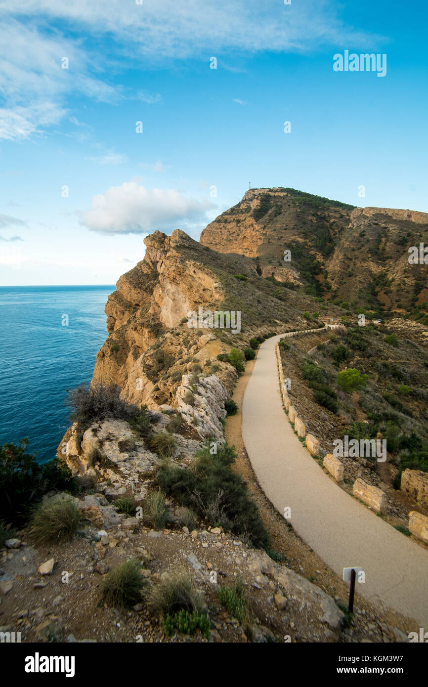 Sierra Helada cliffs and scenic road to its lighthouse overlooking ...